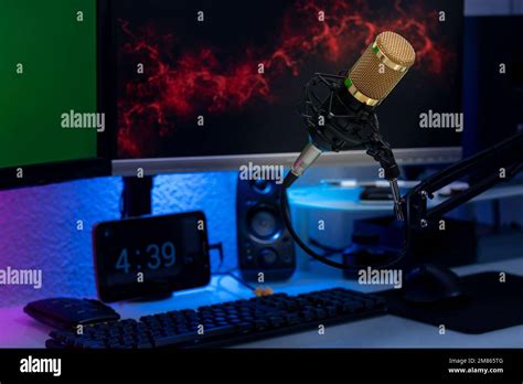 Condenser Microphone In Gamer Setup With Monitors Keyboard Mouse And