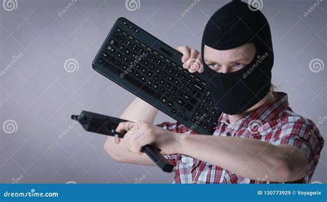 Man In Balaclava Holding Keyboard And Gun Stock Image Image Of