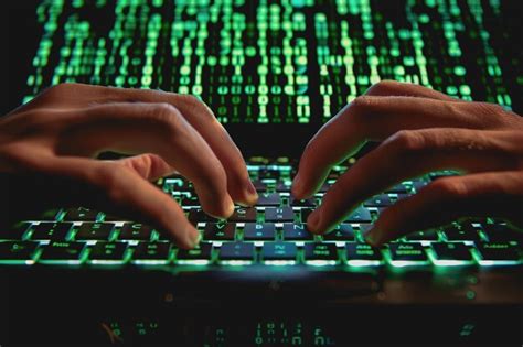 premium photo programmers hands on keyboard writing source code