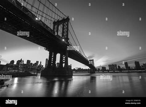 Black And White Image Of Manhattan Skyline And Manhattan Bridge At