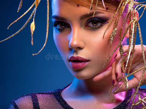 Stylish Fashion Model With A Golden Decoration Around Her Face Beauty