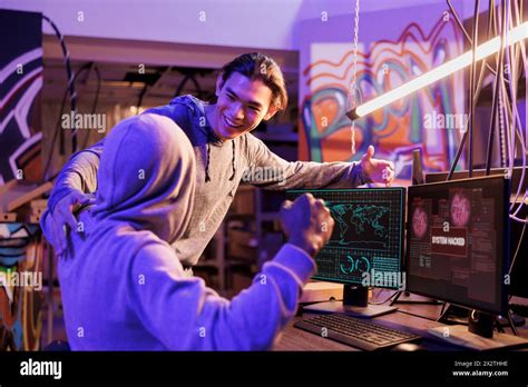 Successful Criminals Gaining Unauthorized Access To Computer Network And Celebrating With