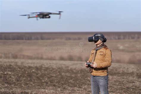A Man Controls A Drone In Special Fpv Goggles Stock Image Image Of