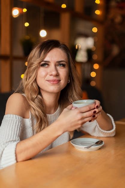 Free Photo Woman Enjoying Cup Of Coffee