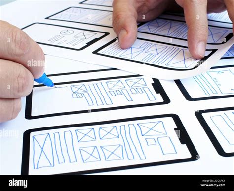 The UX UI Designer Develops The Design Of A Mobile Application Stock Photo Alamy