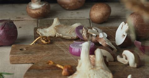 A Person Chopping Mushrooms On A Cutting Board Photo Soup Image On