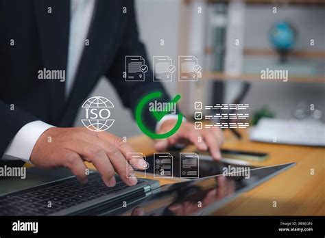 Quality Control Businessman Using Laptop With Iso Certification