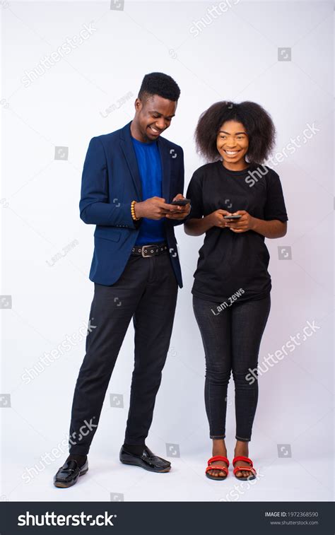 man and woman standing next to each other