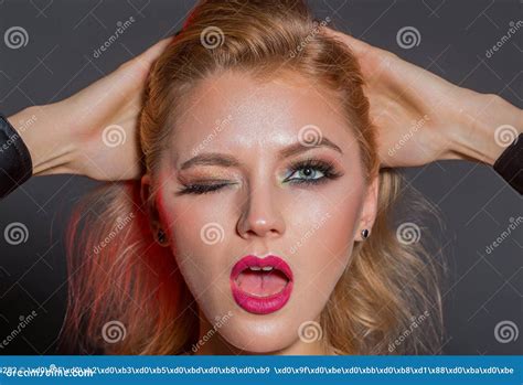 Portrait Of Funny Girl With Winking With One Eye Bright Makeup Flirty