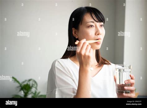 Woman Brushing Her Teeth Stock Photo Alamy