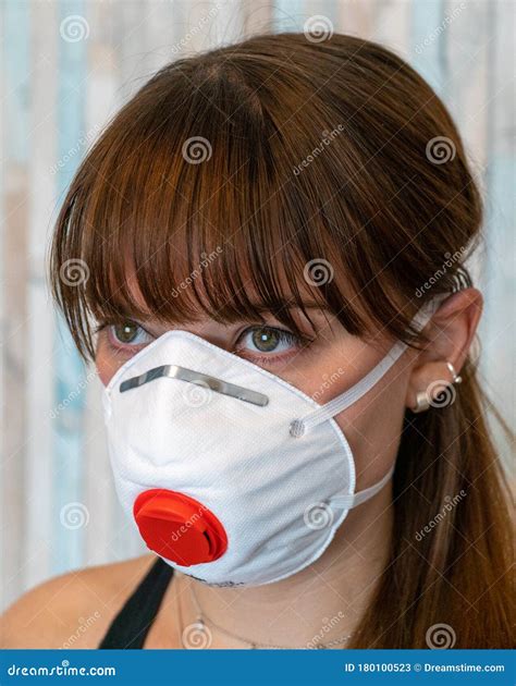 Close Up Face Of Young Woman Wearing Medical N95 Respirator Stock Image