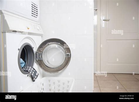 Laundry Concept White And Modern Washing Machine With Open Door