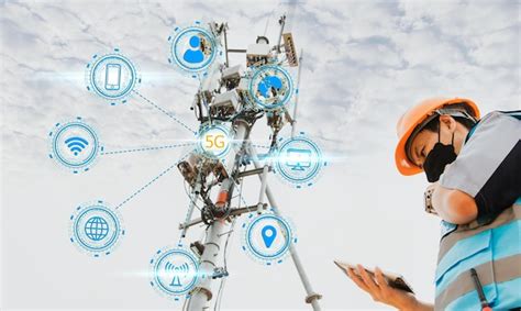 Premium Photo Asian Male Engineer Works Field Using Tablet To Monitor Telecommunication