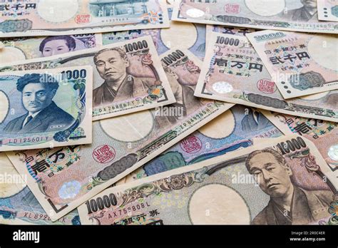 Japanese Currency View Looking Down At A Pile Of Japanese Banknotes In