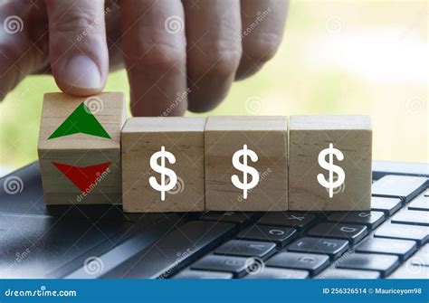 Currency Fluctuation With Dollar Sign On Wooden Blocks Currency