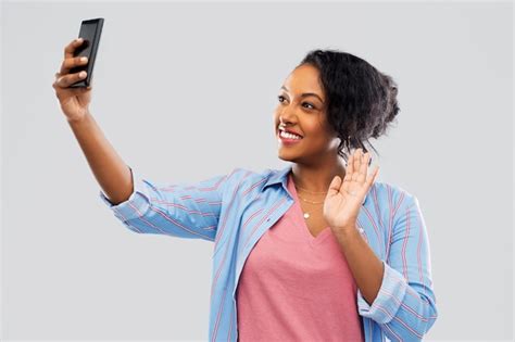 Premium Photo African American Woman Taking Selfie By Smartphone