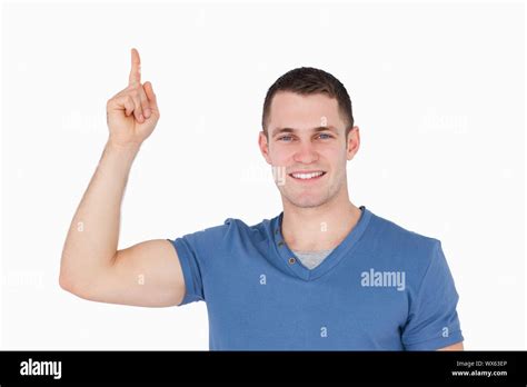Man Pointing At Something Against A White Background Stock Photo Alamy