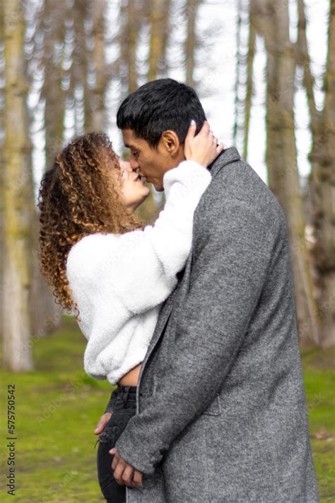 Beautiful Young Couple Kissing In The Forest Cute Couple In Love