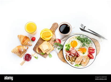 English Breakfast With Fried Egg Sausage Bacon And Toast On White