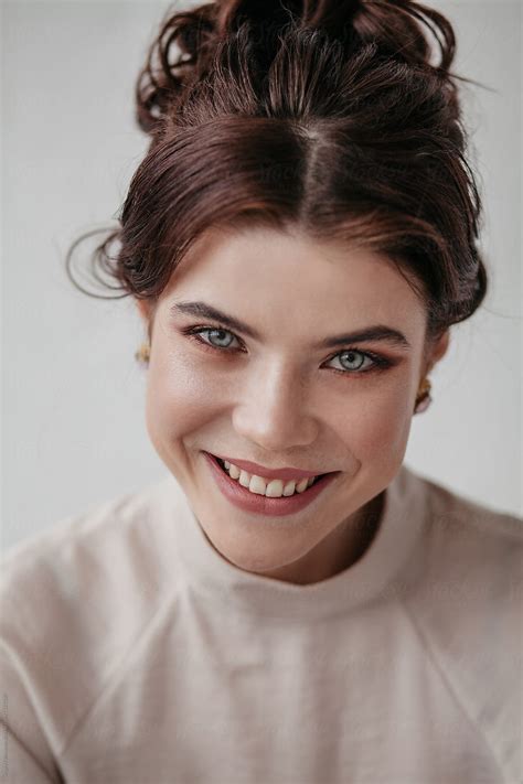 Beautiful Cheerful Model Looking At Camera By Stocksy Contributor