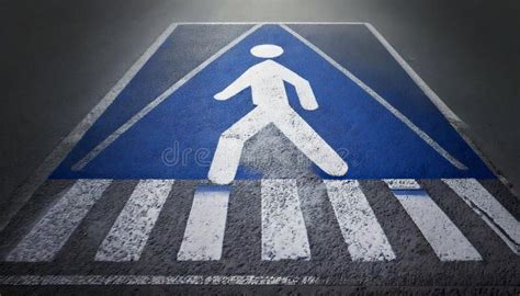Pedestrian Crossing Sign On A Road Indicating Safe Passage For Walkers
