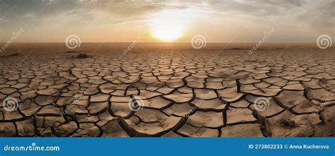 Desertification Problem Wide Panorama Of Barren Cracked Land On Sunset