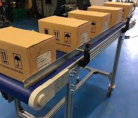 Stainless Steel Vertical Conveyors Box Handling Conveyor Capacity